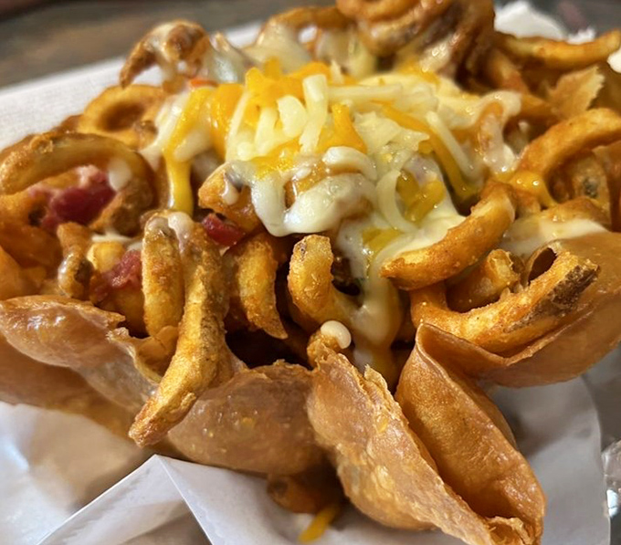 Behold the loaded curly fries&mdash;a magnificent mess of melted cheese, bacon, and potato spirals that renders napkins essential and diets optional.