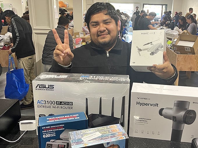 Victory looks like this: high-end electronics at bargain basement prices. That smile says "I just saved enough for dinner at Nobu."