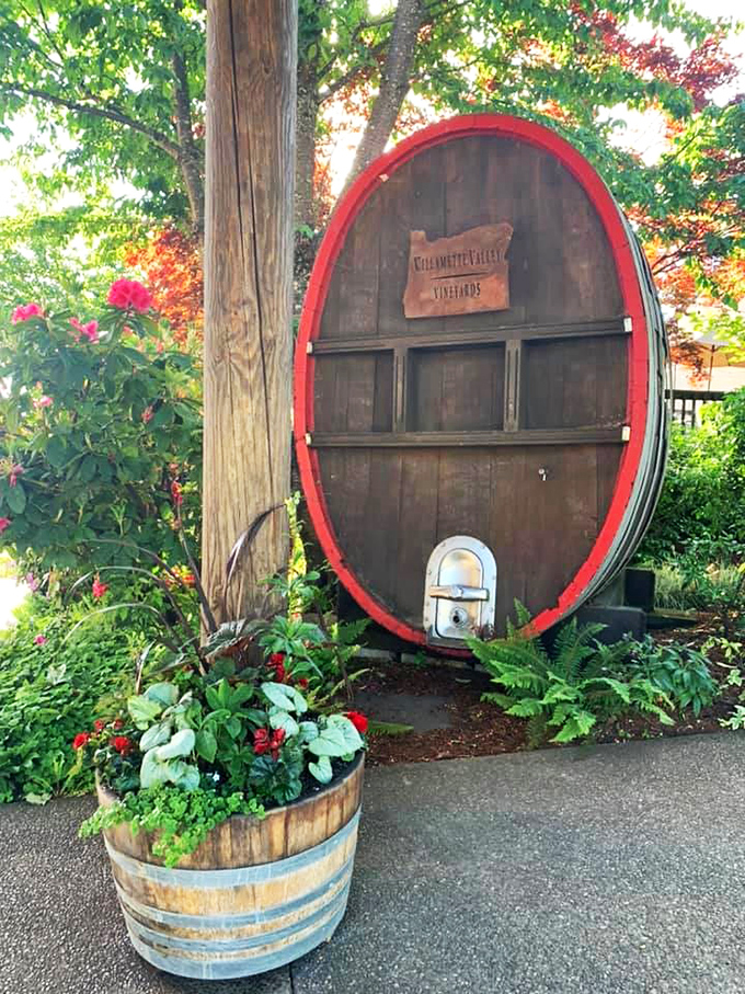 This charming barrel display welcomes guests with authentic wine country character and whimsical garden touches.
