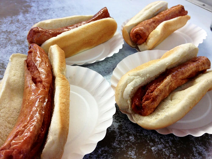 The legendary Rippers in their natural habitat—deep-fried hot dogs with perfectly split casings that snap with each bite like culinary firecrackers.