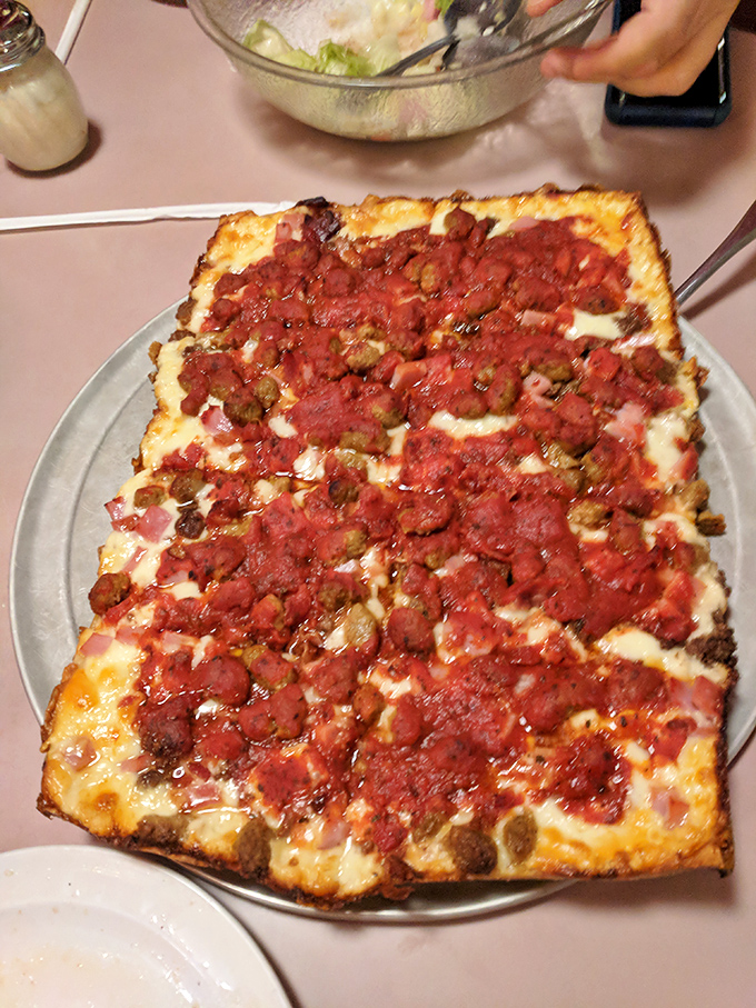Detroit-style pizza in its natural habitat: rectangular, crispy-edged, and unapologetically loaded with toppings that mean business.