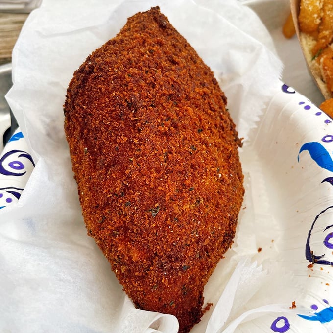 Deviled crab with a crust so perfectly seasoned, it could make a vegetarian reconsider their life choices entirely.