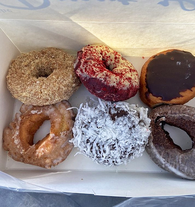 A box of donuts this diverse deserves its own United Nations representation&mdash;from coconut-dusted to chocolate-glazed, each one a different path to bliss.