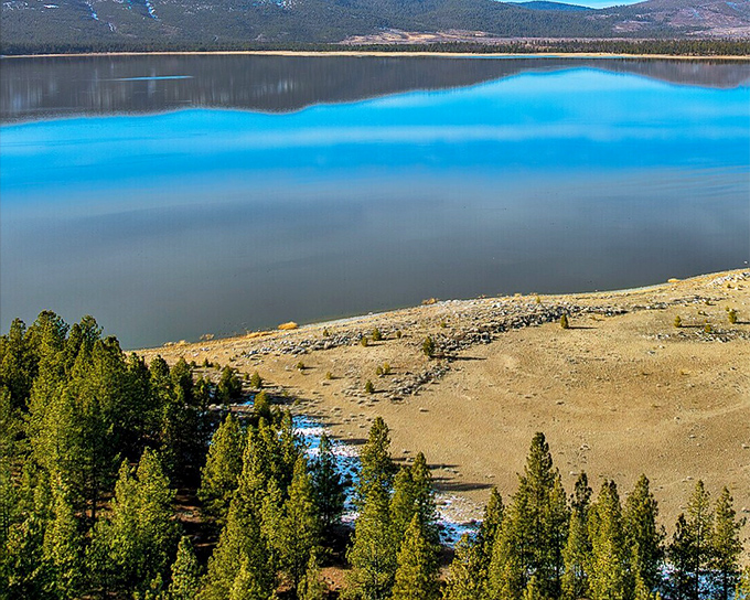 Eagle Lake mirrors the sky so perfectly you might forget which way is up – California's second-largest natural lake without the tourist crowds.
