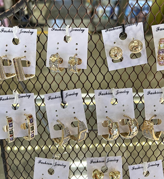 Gold glitters under fluorescent lights as earrings dangle with promise. One person's costume jewelry is another's statement piece waiting to happen.