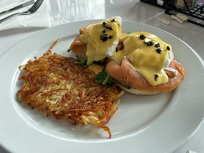 Eggs Benedict that would make a brunch enthusiast weep tears of hollandaise joy. That crispy hashbrown deserves its own fan club.