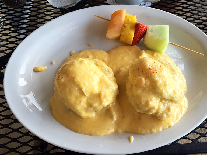 These eggs Benedict aren't just breakfast, they're architecture—golden domes of yolk atop perfectly crafted foundations of flavor and texture.