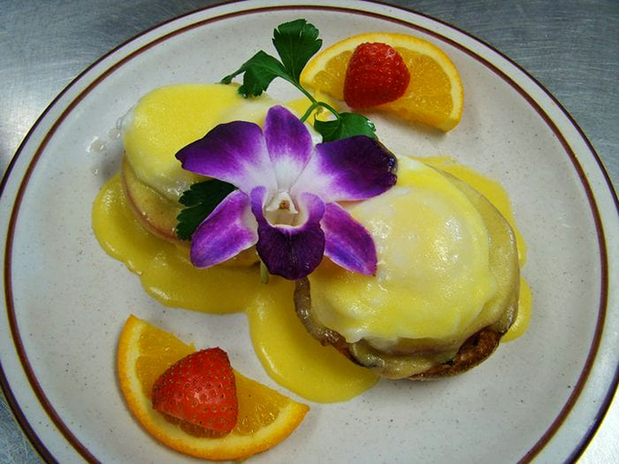 Eggs Benedict gets the royal treatment with vibrant garnishes and hollandaise so yellow it could outshine the morning sun.