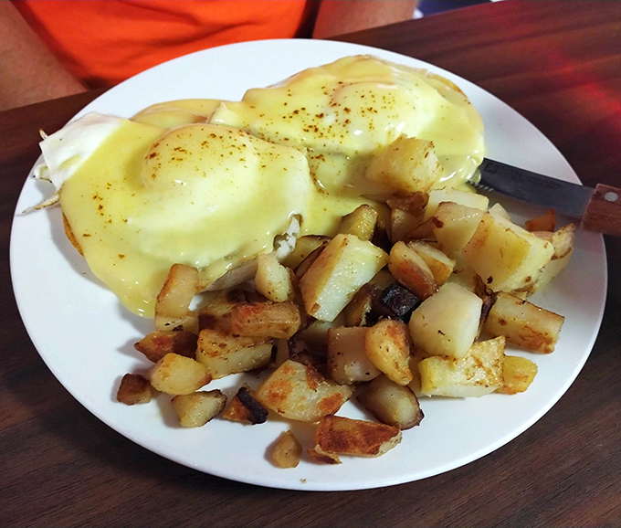 Eggs Benedict that would make the Pope jealous, with home fries so perfectly seasoned they deserve their own fan club.