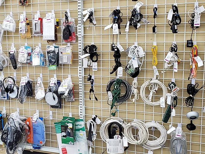 The wall of electronic accessories &ndash; a tangle of cords and chargers that somehow represents both our technological past and present.