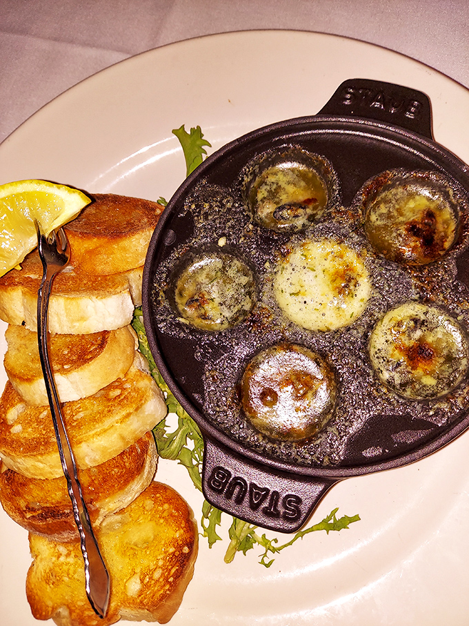 Escargot that would make Julia Child weep with joy, swimming in garlicky butter and served with crusty bread for essential sauce-sopping operations.