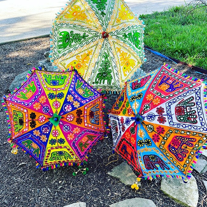 Portable works of art! These vibrant embroidered umbrellas bring a splash of color to even the rainiest Texas day.
