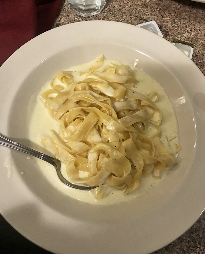 Fettuccine Alfredo so authentic and creamy it could make an Italian grandmother weep with joy and reach for her recipe book.