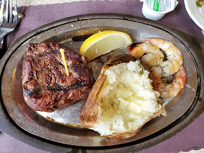 Surf and turf Wisconsin-style: a tender filet mignon sharing the spotlight with plump shrimp and a potato that's been living its best buttery life.