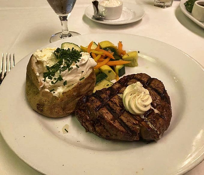 This isn't just dinner; it's a balanced relationship&mdash;a perfectly seared filet mignon maintaining a respectful distance from its loaded baked potato companion.