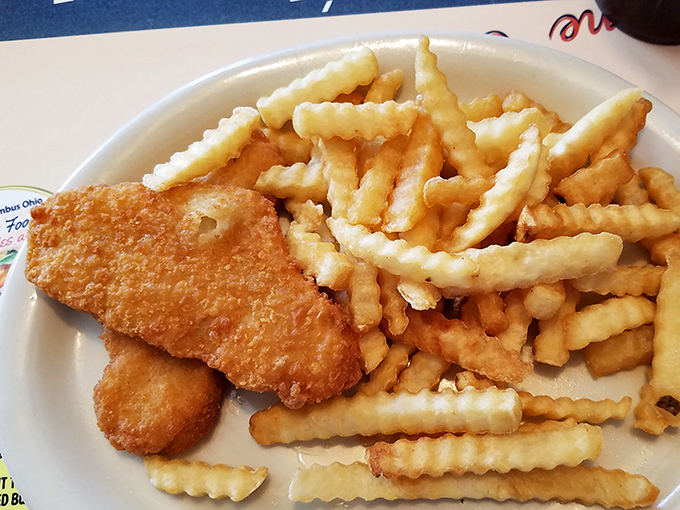 Golden-battered fish and crinkle-cut fries—the comfort food equivalent of a warm hug from your favorite aunt who always sneaks you extra dessert.