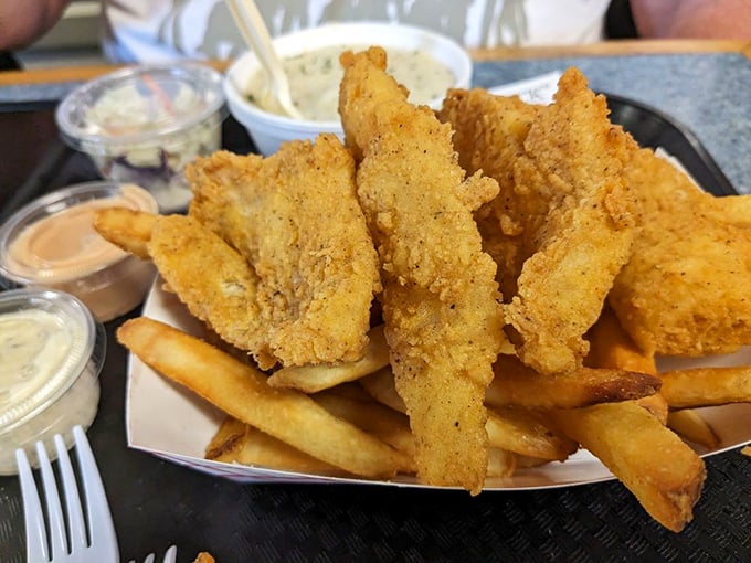 Golden-battered fish perched atop a bed of fries&mdash;the seafood equivalent of a perfect high-five after a long drive. 