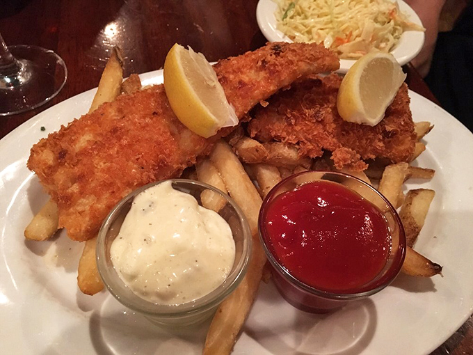 Golden-brown perfection: potato-crusted cod with hand-cut fries and house-made accompaniments that elevate this classic far beyond your average fish and chips.