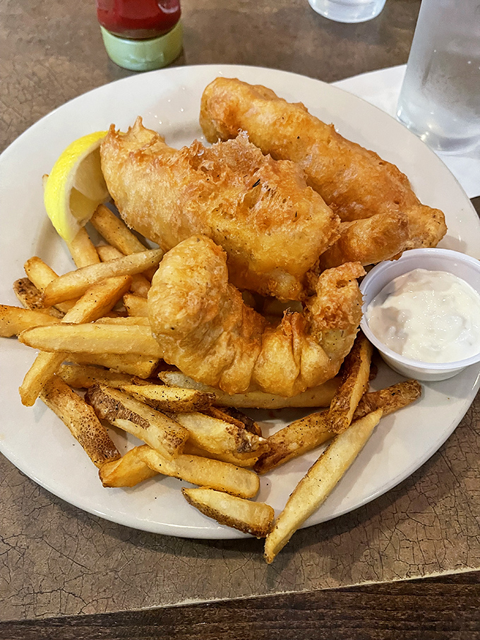 Golden-battered fish that shatters with each bite, paired with fries that could make a potato proud. Simple perfection needs no explanation.