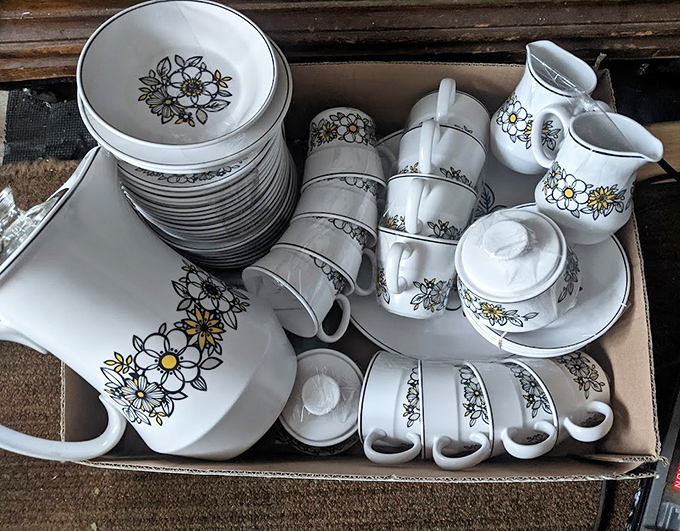 Floral dishware that once served family dinners now waits for a new table. Grandma's pattern is always coming back in style.