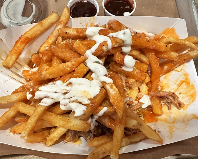 These aren't just any fries &ndash; they're the canvas for a masterpiece of pulled pork, cheese, and sauce. Diet plans, consider yourselves officially on pause.
