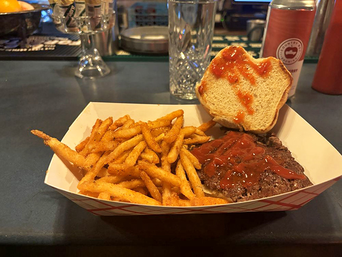 Golden fries and a smashburger patty with sauce&mdash;proof that sometimes the simplest pleasures are the most satisfying.