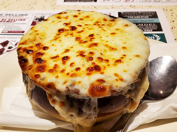 French onion soup with a cheese cap so perfectly browned and bubbly, it's practically wearing a crusty crown fit for diner royalty.