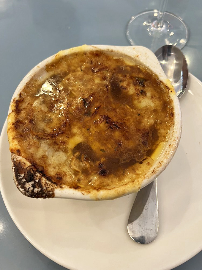 French onion soup that doesn't just warm your soul but gives it a bear hug, with a cheese cap that stretches dramatically with each spoonful.