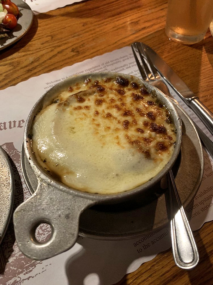 French onion soup with a properly browned cheese top is comfort in a crock, no matter the century.