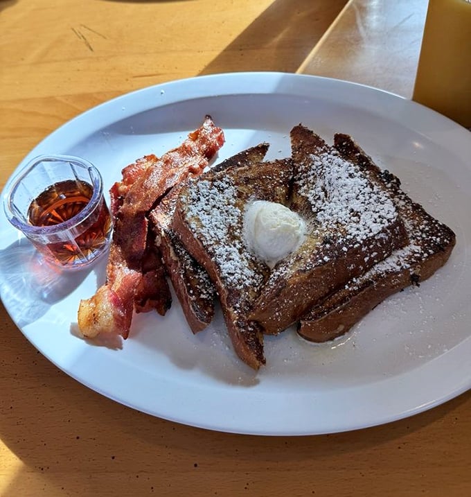 French toast that's dressed for success, dusted with powdered sugar and accompanied by bacon that's achieved that perfect crispy-chewy harmony.