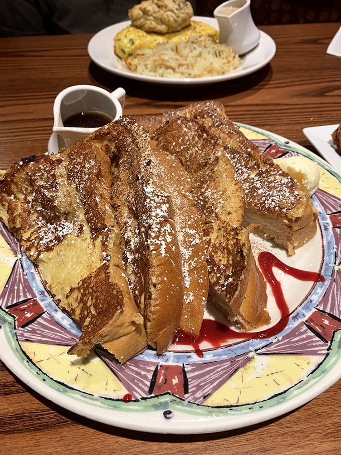 French toast that's dressed for success with powdered sugar formalwear and a berry-red sauce that means business.