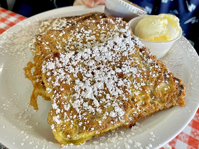 French toast so perfectly golden and powdered, it could make a pastry chef weep with envy and admiration.