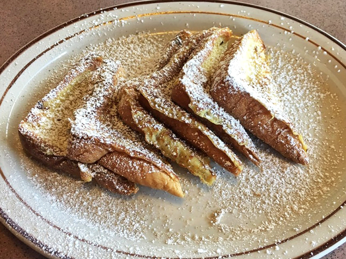 French toast that's dressed for success with a snowfall of powdered sugar. Whoever said "don't play with your food" never had this masterpiece.
