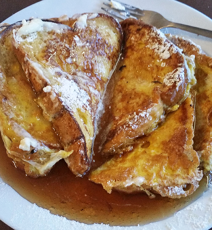 French toast that's achieved the impossible trifecta: crispy edges, custardy center, and enough maple syrup to make Canadians weep with joy.