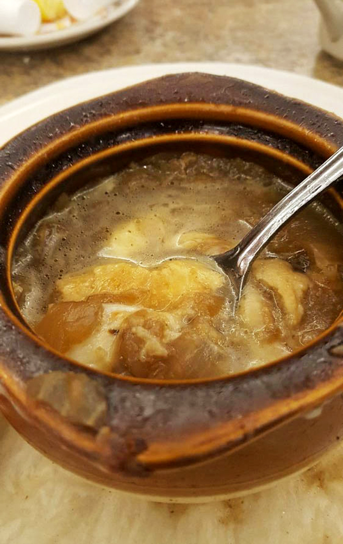 French onion soup that doesn't mess around – the melted cheese stretches dramatically with each spoonful like it's auditioning for a food commercial.