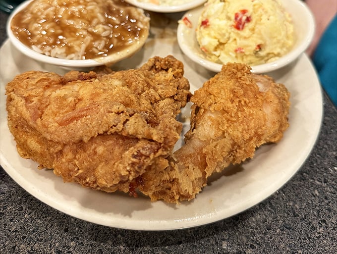 Fried chicken that renders conversation impossible except for appreciative murmurs. The crispy exterior gives way to juicy perfection that defines Southern cooking.