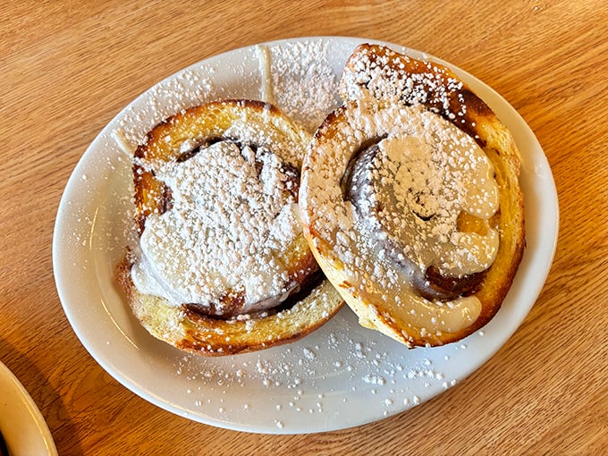 Cinnamon rolls dusted with powdered sugar – where breakfast meets dessert and nobody's complaining about it.