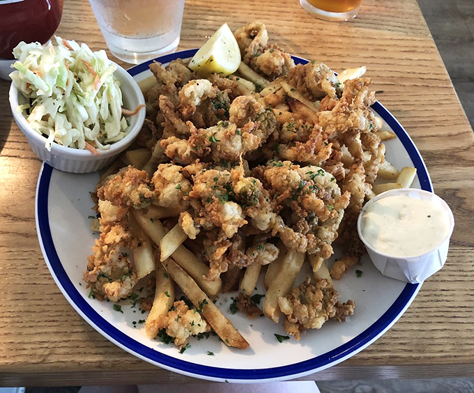 Fried clams so perfectly golden, they deserve their own trophy. The accompanying slaw provides the perfect crisp counterpoint to each tender bite.