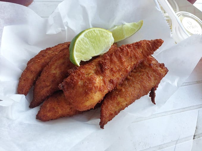 Fried fish so fresh it was probably swimming this morning. That crispy exterior gives way to flaky perfection that needs nothing more than a squeeze of lime.
