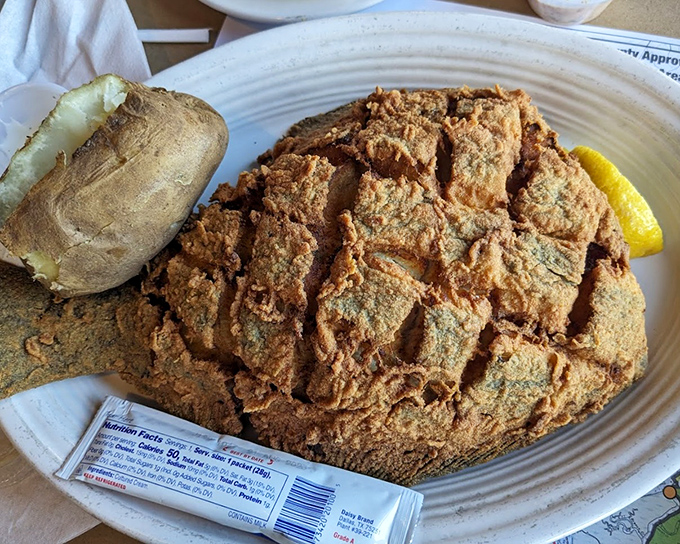The Whole Fried Flounder in all its golden glory. This impressive plate transforms a humble fish into a showstopping centerpiece.