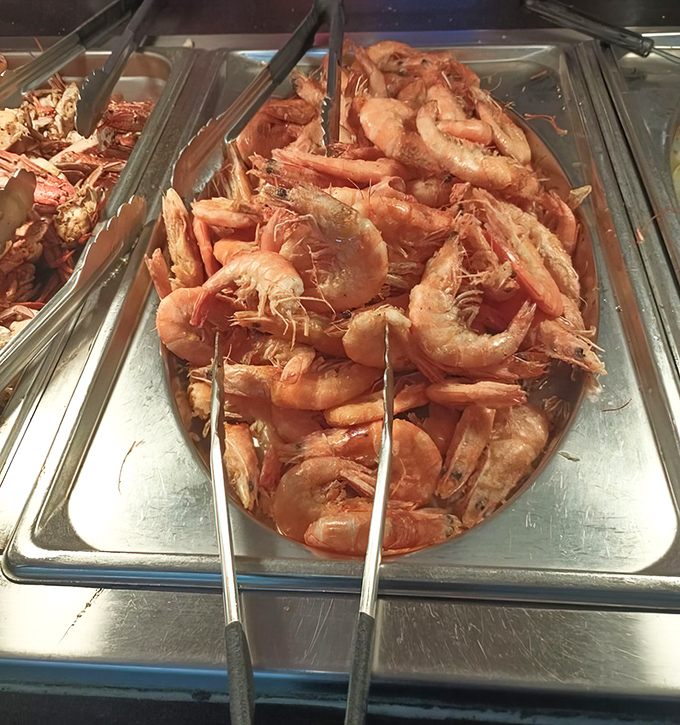 Plump shrimp bathing in their own juices, like tiny pink crescents of the sea that practically beg you to grab those tongs.