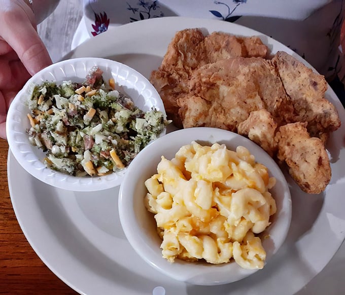Southern cooking's greatest hits on one plate: crispy pork chop, creamy mac and cheese, and a broccoli salad that might actually make you eat vegetables.