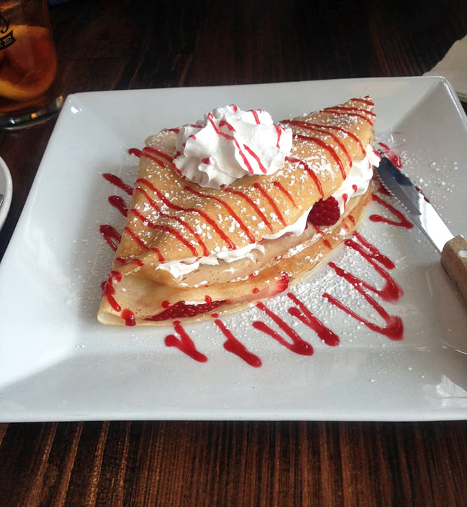 Dessert or artwork? This berry-adorned sweet crepe with its perfect drizzle pattern would make even French pastry chefs nod in approval.