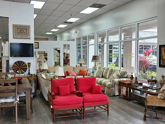 Red accent chairs pop against neutral sofas in the furniture section, creating ready-made living room setups that inspire even the decoration-challenged among us.