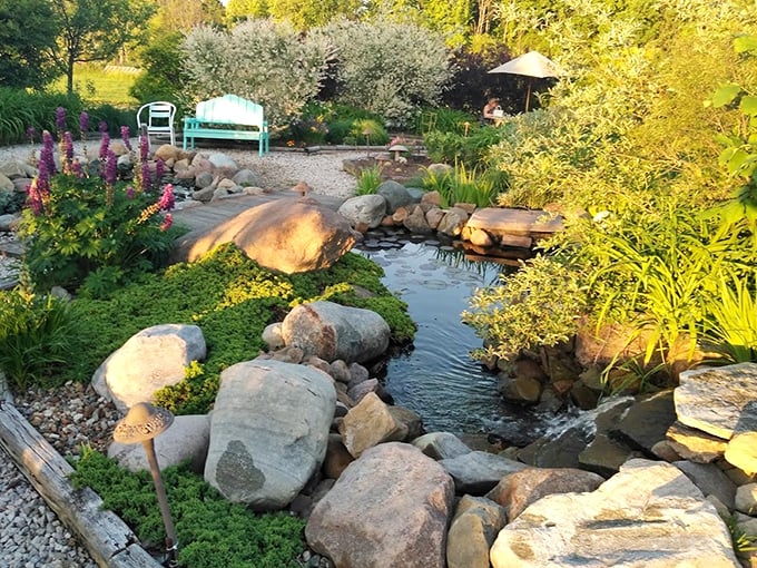 A tranquil pond garden where koi fish probably live better lives than most of us&mdash;complete with their own water features.