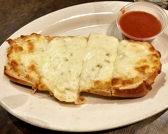 Garlic cheese toast that puts ordinary garlic bread to shame. The perfect tool for sopping up every last drop of that legendary sauce.