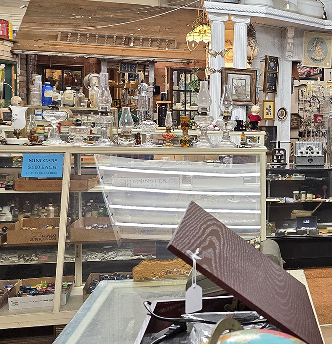 Crystal catches light like memories catch emotions in this display of vintage oil lamps and glassware that transforms ordinary shelves into museum-worthy exhibits.