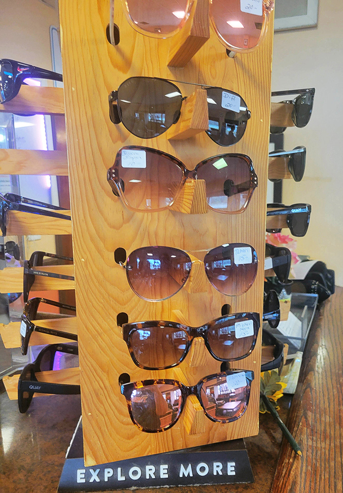 Sunglasses galore on this wooden display stand &ndash; designer shades at thrift store prices might be the ultimate Florida fashion hack.