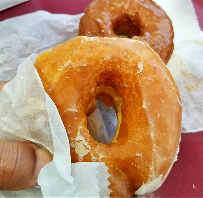 The humble glazed donut, perfected. That sheen isn't just glaze&mdash;it's a mirror reflecting your imminent happiness.