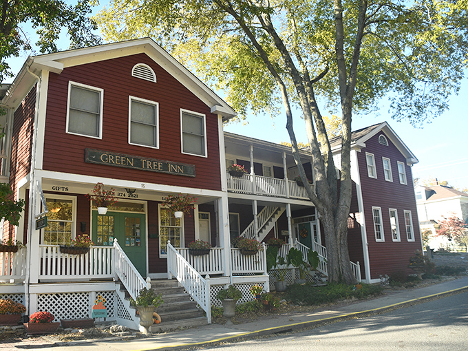 The Green Tree Inn's crimson facade and white porch railings offer more than just lodging &ndash; they're a portal to experiencing Elsah as locals do.